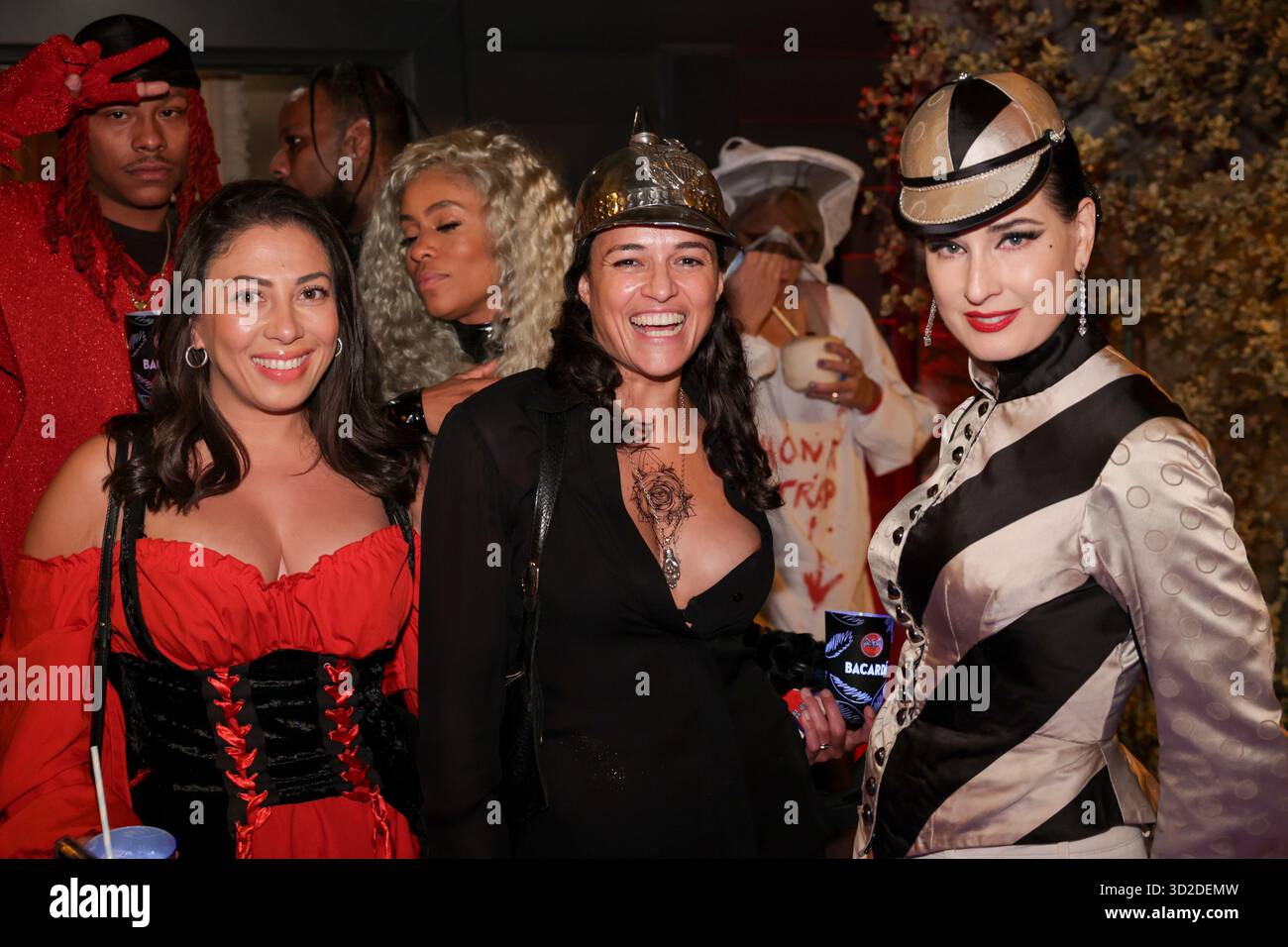 Imene Meziane, from left, Michelle Rodriguez, and Dita Von Teese attend ...