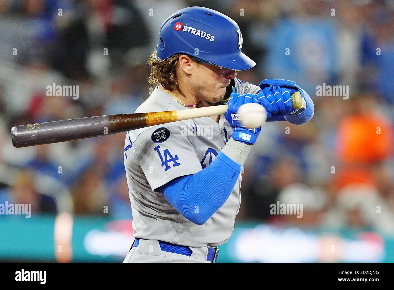 Los Angeles Dodgers' Enrique Hernández (8) checks his swing on a high ...