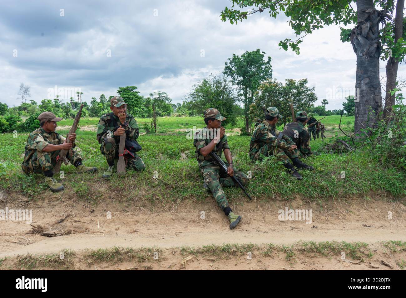 Soldiers from Battalion 12 in Shwe Bo District take a break during a ...