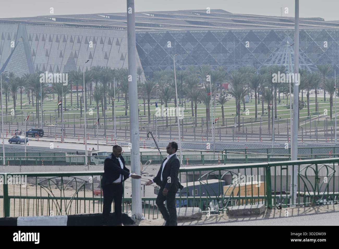 Plain clothes policemen stand alert as they guard before the opening of ...