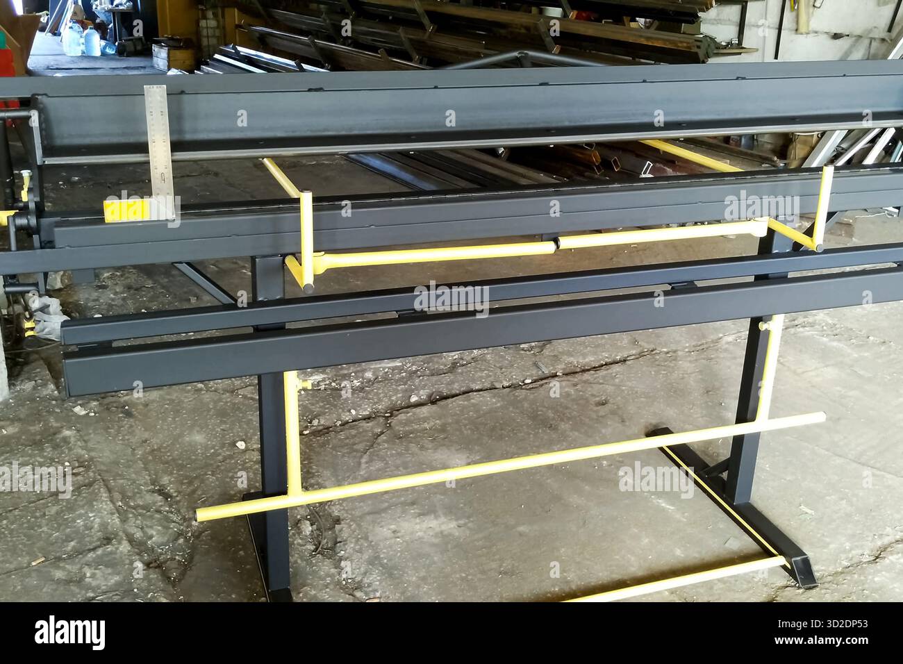 Machine for bending steel sheets. Plate bending machine Stock Photo - Alamy