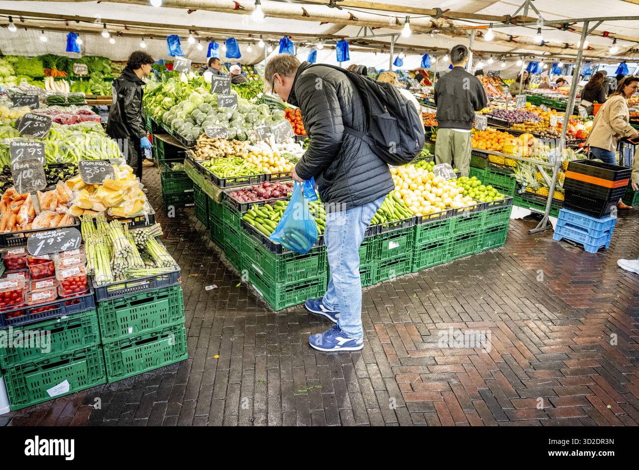 ROTTERDAM - People at the market in Rotterdam. Prices continue to rise ...
