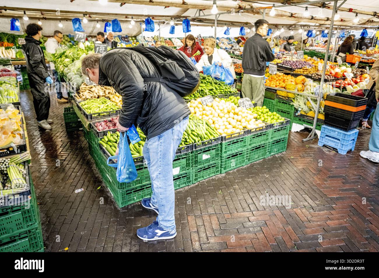 ROTTERDAM - People at the market in Rotterdam. Prices continue to rise ...