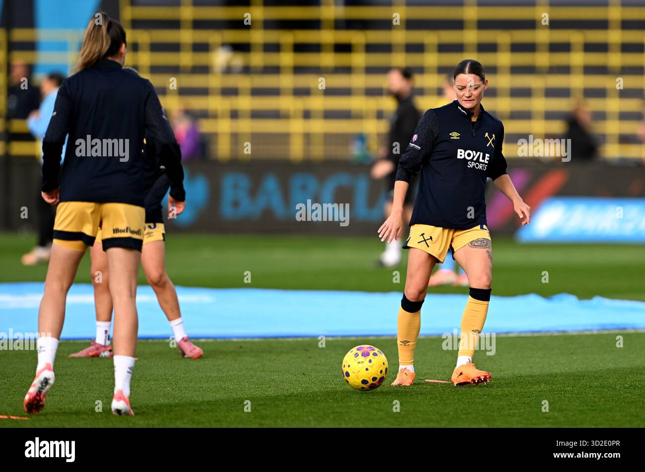 West Ham United's Verena Hanshaw (right) warming up before the Barclays ...