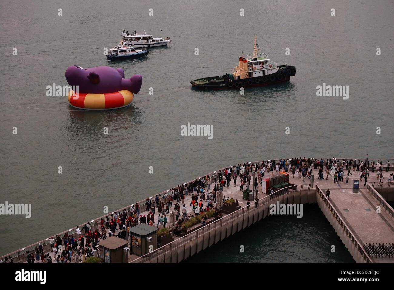 A giant inflatable floats by during a Water Parade at Victoria Harbour ...