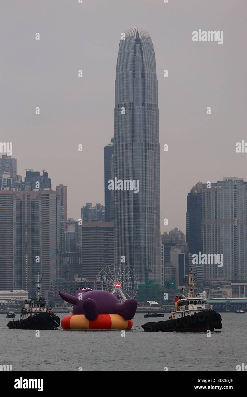 A giant inflatable floats by during a Water Parade at Victoria Harbour ...