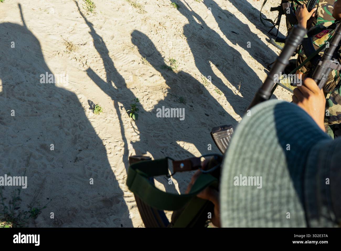 Soldiers from Battalion 12 in Shwe Bo District sit in formation before ...