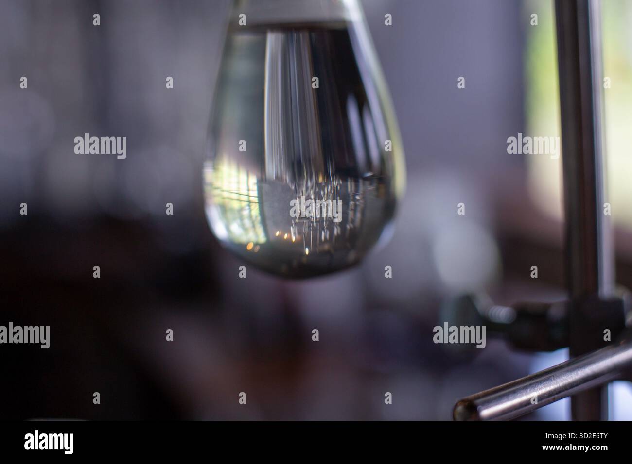 Selective focus Clear glass tubes in a laboratory with many reflections ...