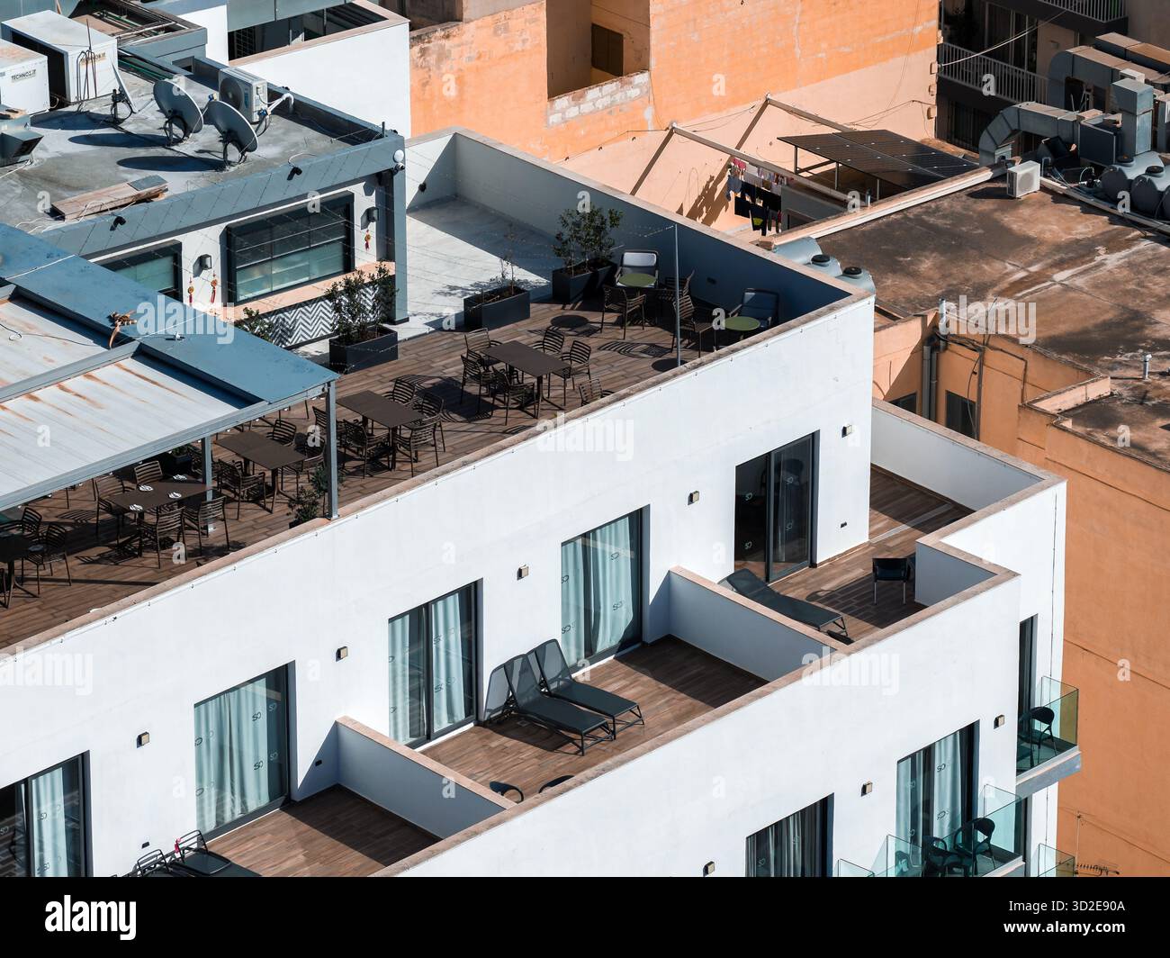 Rooftop terraces of modern white building in Mellieha, Malta Stock ...