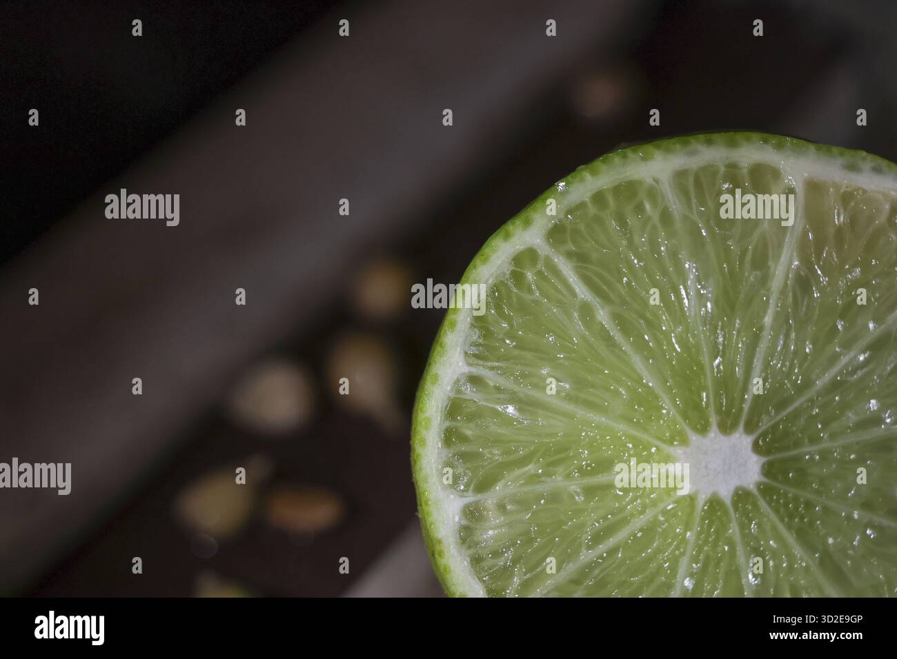 Fresh green lime cut in half showing juicy sour citrus fruit pulp ...