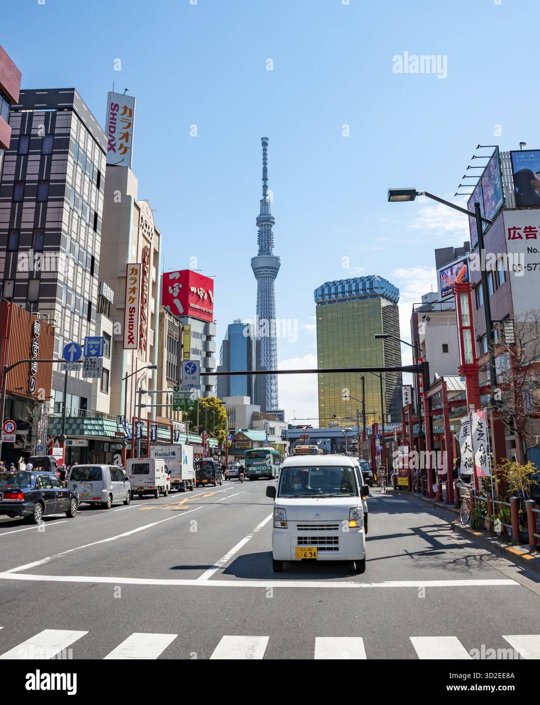 Street with typical Japanese houses, Sumida City skyline in the back ...