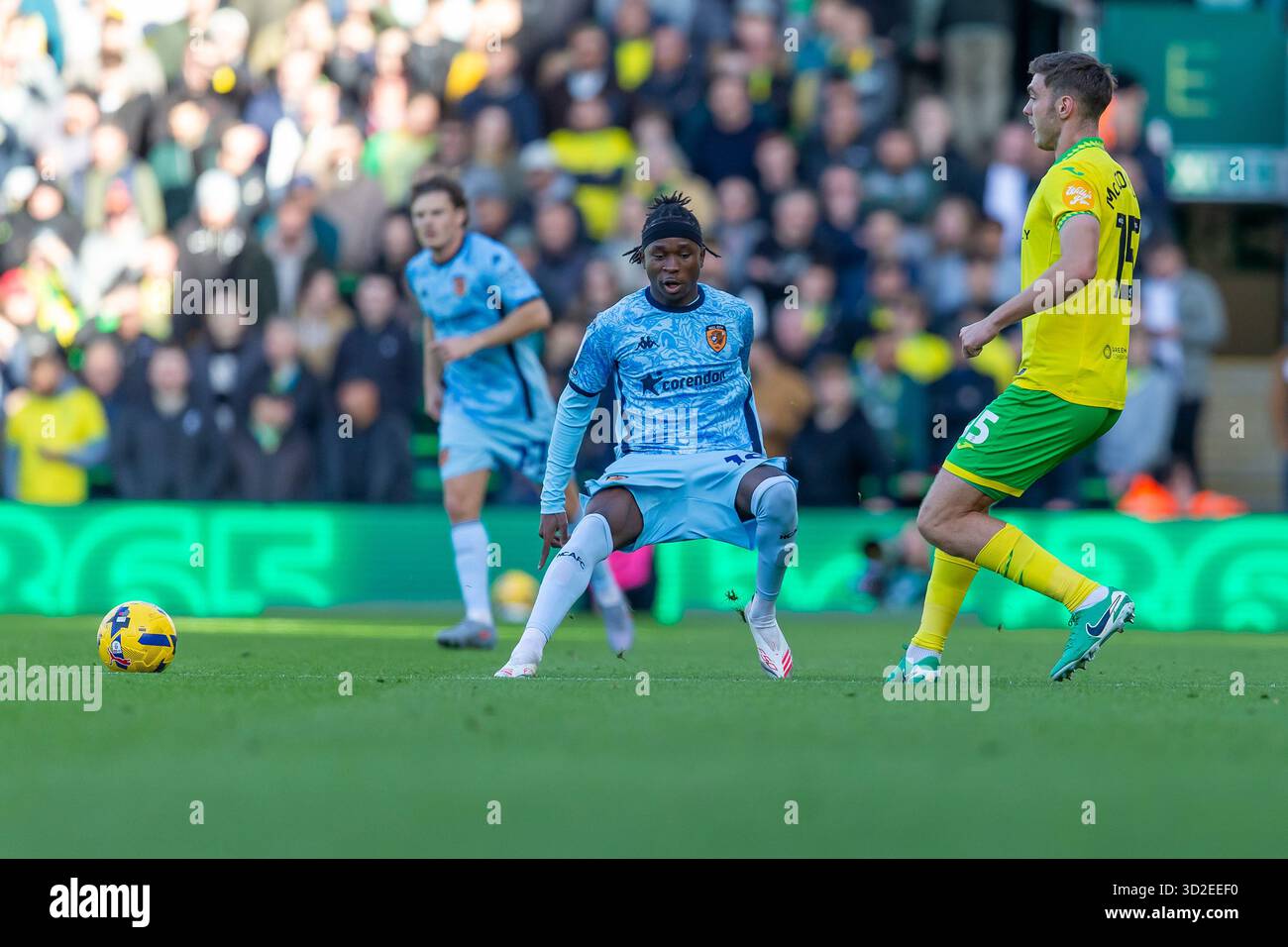 Joel Ndala of Hull City puts pressure on Ruairi McConville of Norwich ...
