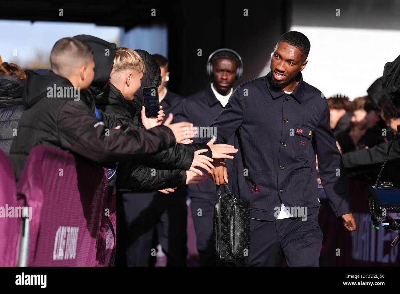 Burnley's Jaidon Anthony (right) greets fans ahead of the Premier ...