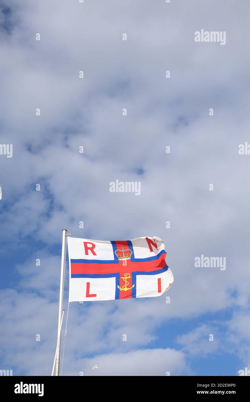 RNLI flag Royal National Lifeboat Institution on Aberystwyth beach ...