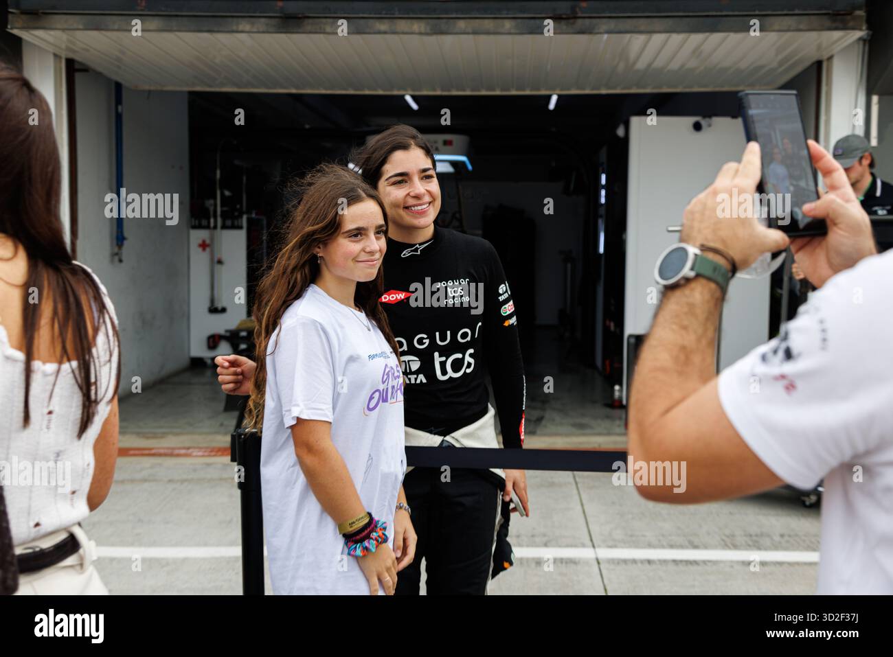 Valencia, Spain. 31st Oct 2025. Jamie Chadwick poses with a member of ...