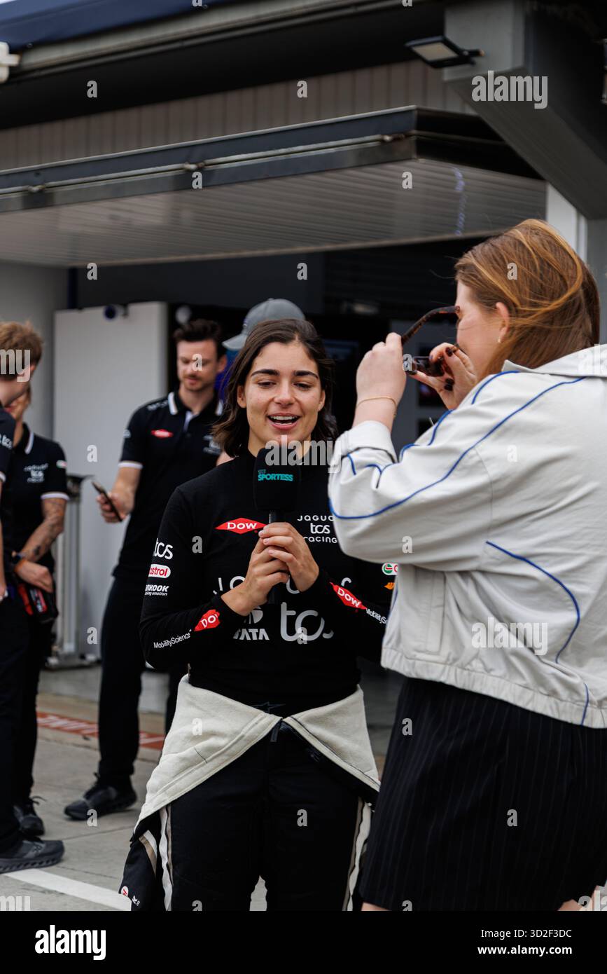 Valencia, Spain. 31st Oct 2025. Jamie Chadwick speaks with a member of ...