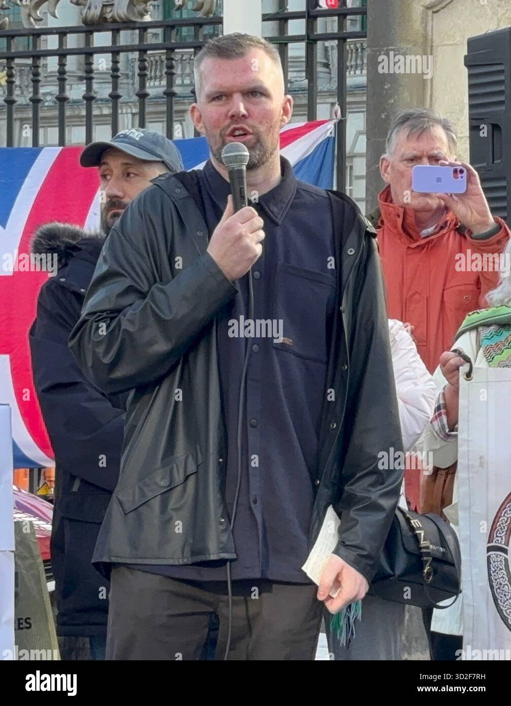 People Before Profit MLA Gerry Carroll speaks at a demonstration at ...