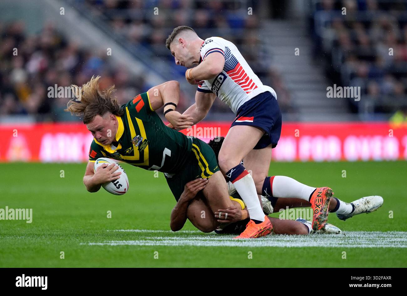 Australia's Reuben Cotter in action with England's Kai Pearce-Paul and ...