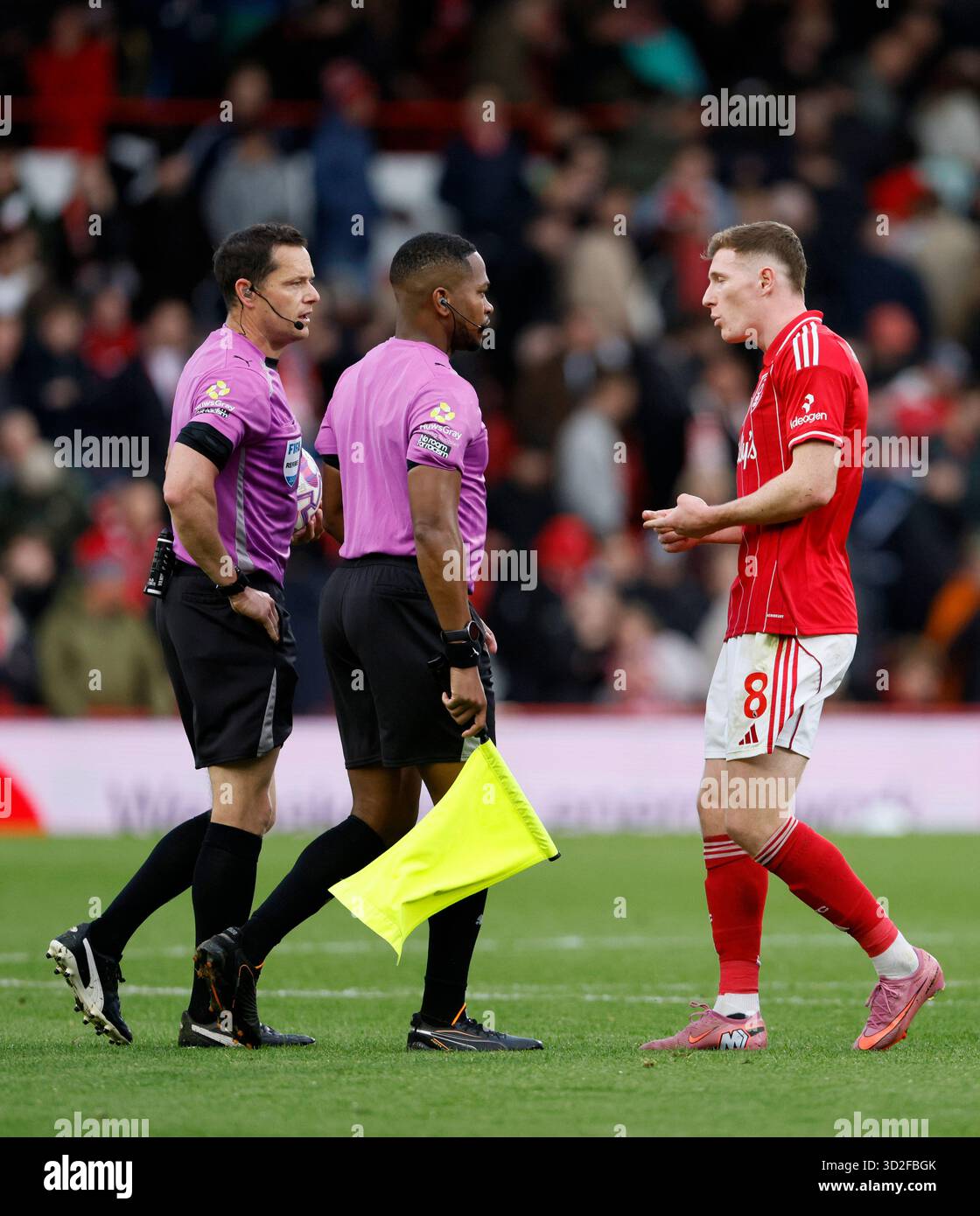 Nottingham Forest's Elliot Anderson speaks with the referee at half ...