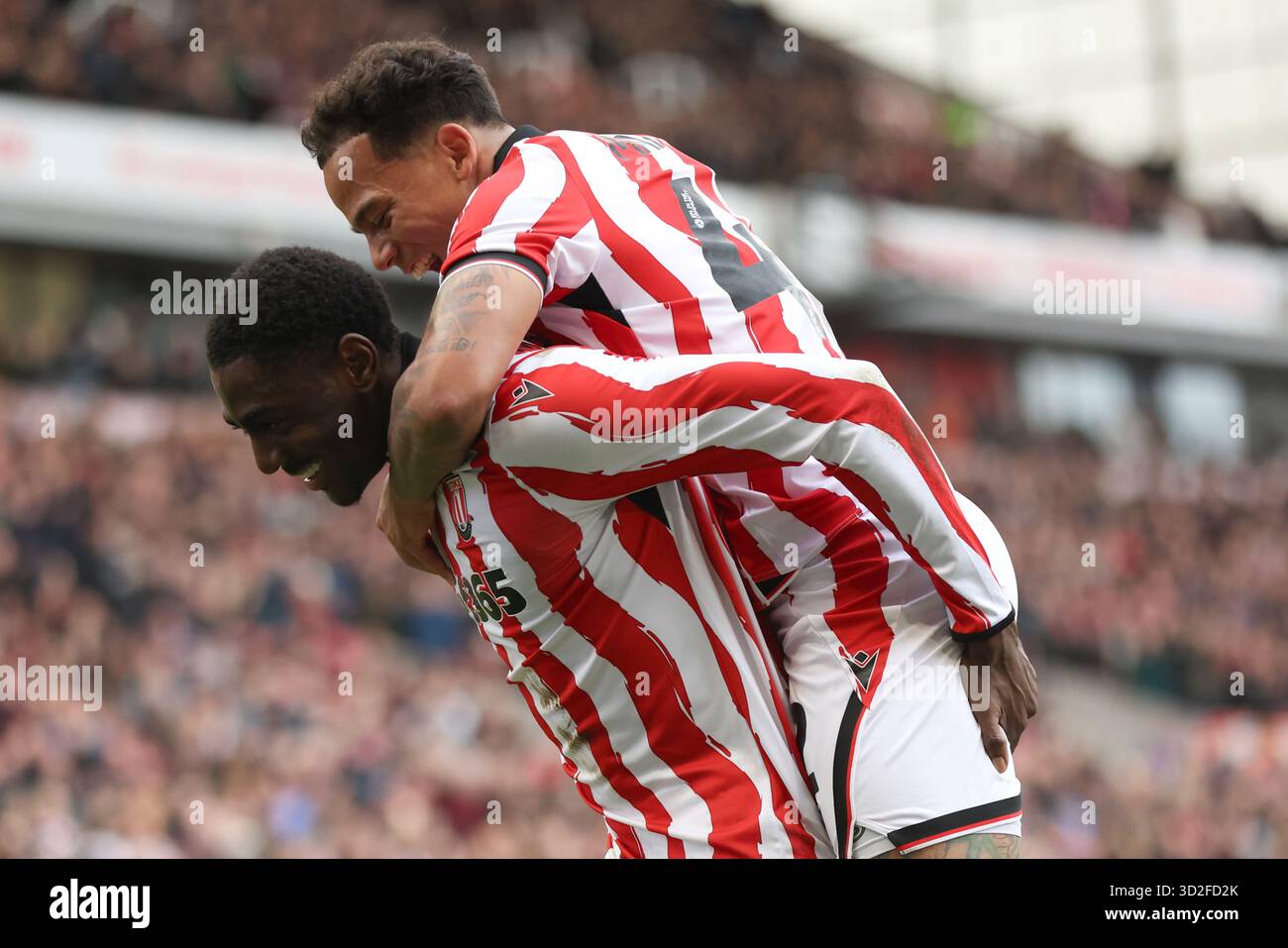 Stoke City's Divin Mubama (left) celebrates scoring their side's second ...