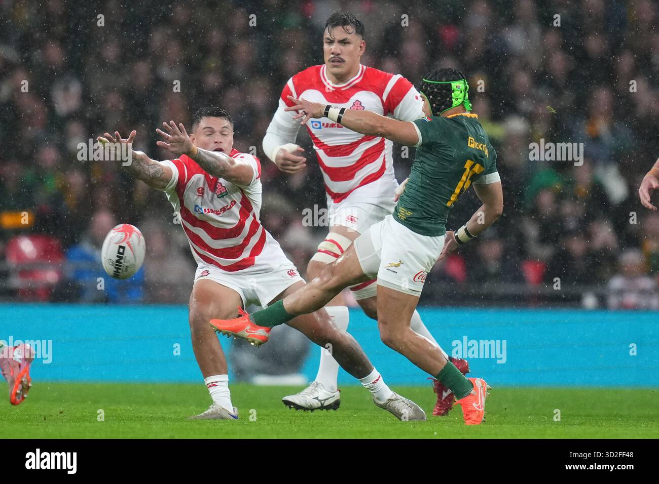 Japan's Charlie Lawrence, left, tries to block a shot by South Africa's ...
