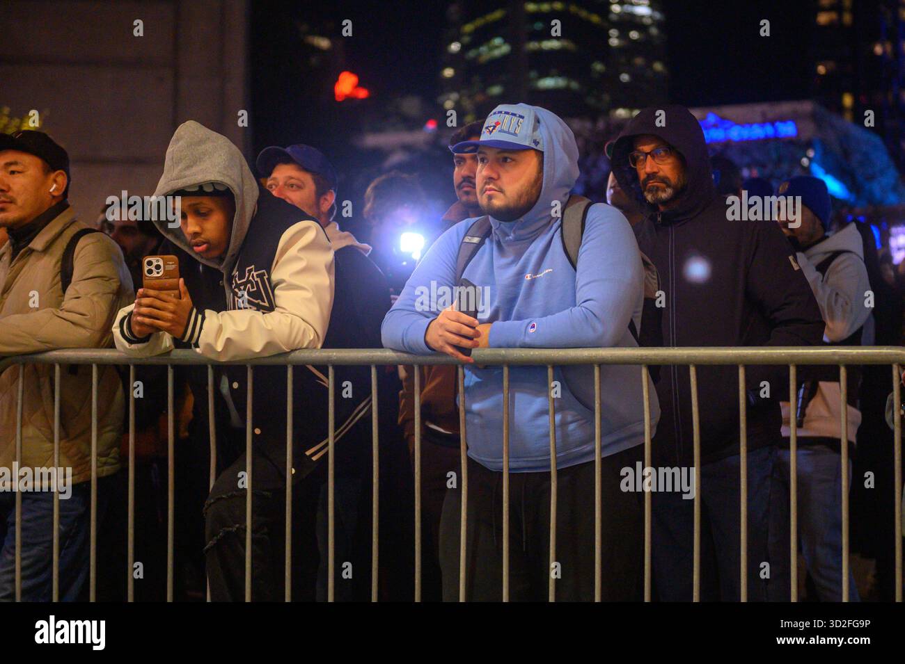 Toronto, ON, Canada – October 31, 2025: A fan watches Game Six of the ...