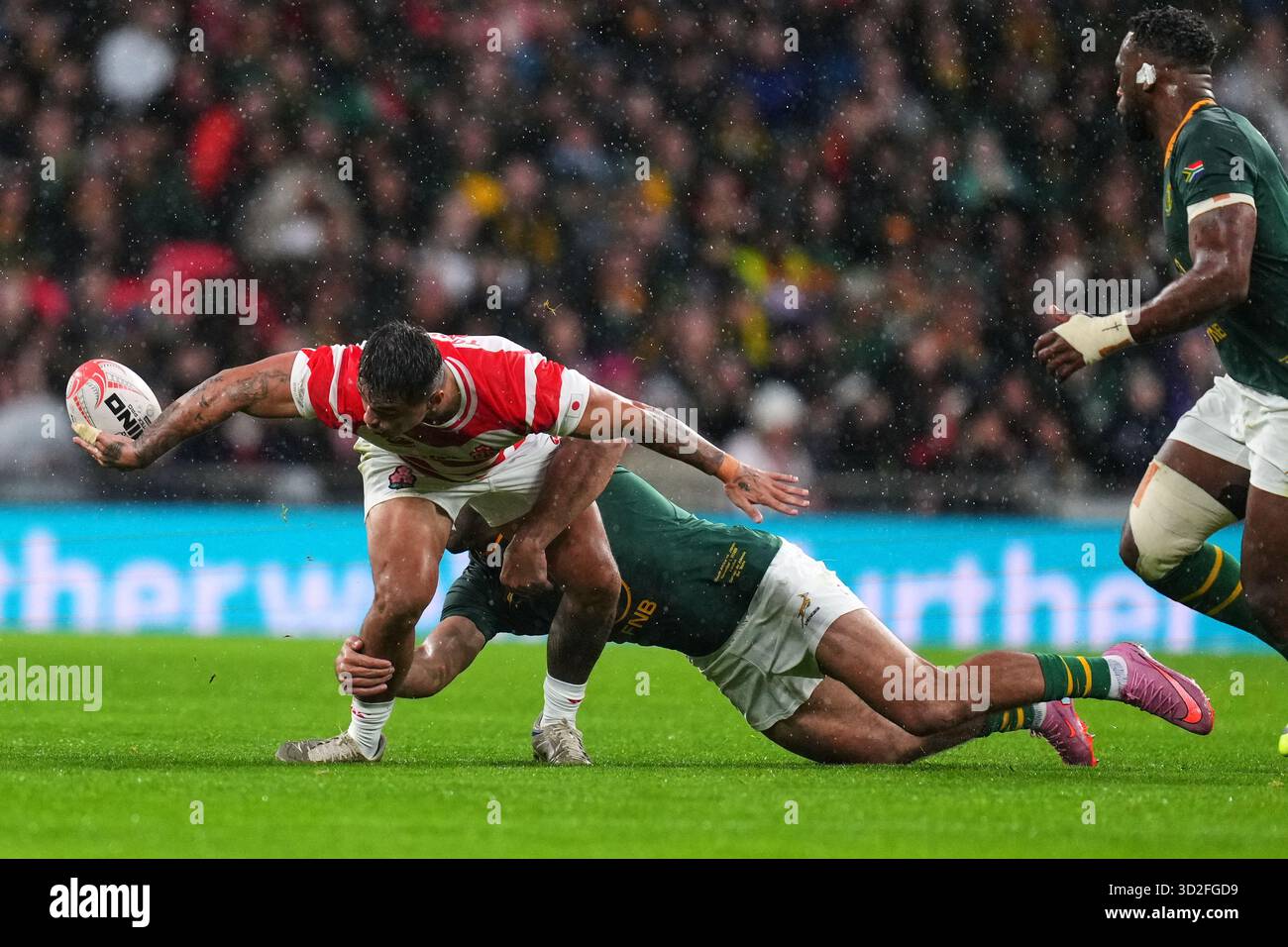 Japan's Charlie Lawrence balances the ball during the rugby union ...