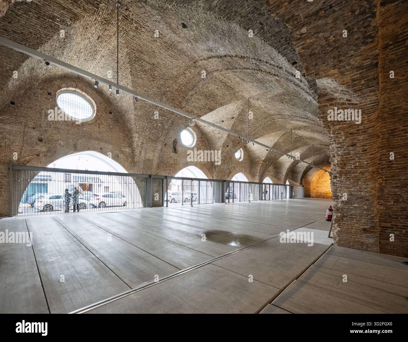 Seville's Atarazanas features historic brick vaults and circular ...