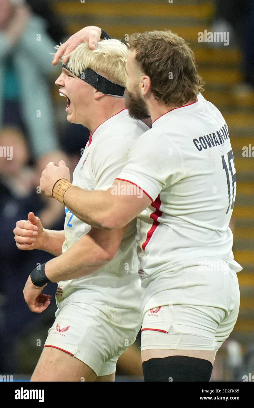 England's Henry Pollock, left, celebrates after scoring a try during ...