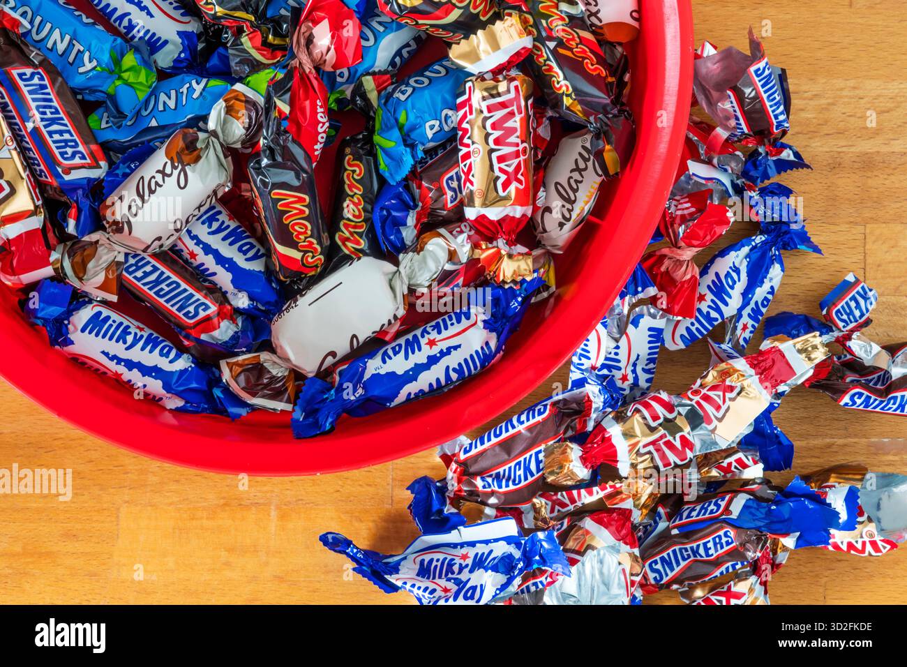 A tub of Celebrations mini chocolate bars made by Mars, together with ...