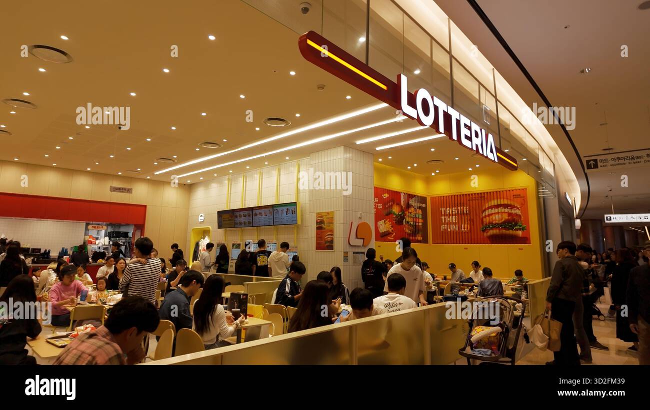 SEOUL, SOUTH KOREA - OCTOBER 11, 2025 - People eating inside a busy ...