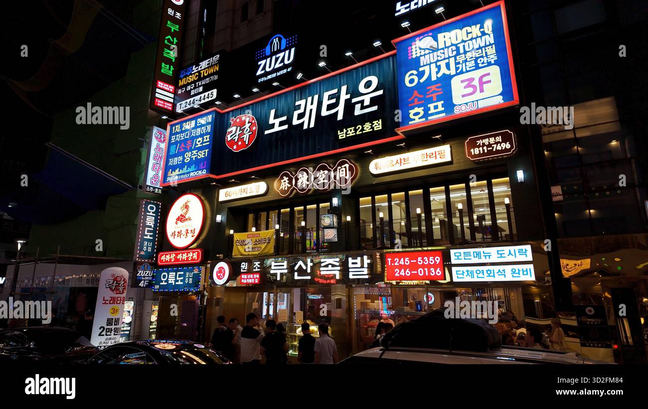 BUSAN, SOUTH KOREA - OCTOBER 10, 2025 - Night view of a busy street ...