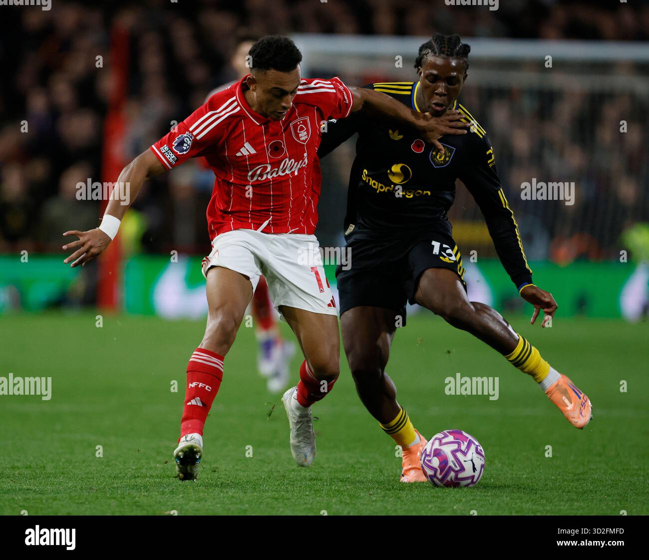 Manchester United's Patrick Dorgu (right) and Nottingham Forest's Dan ...