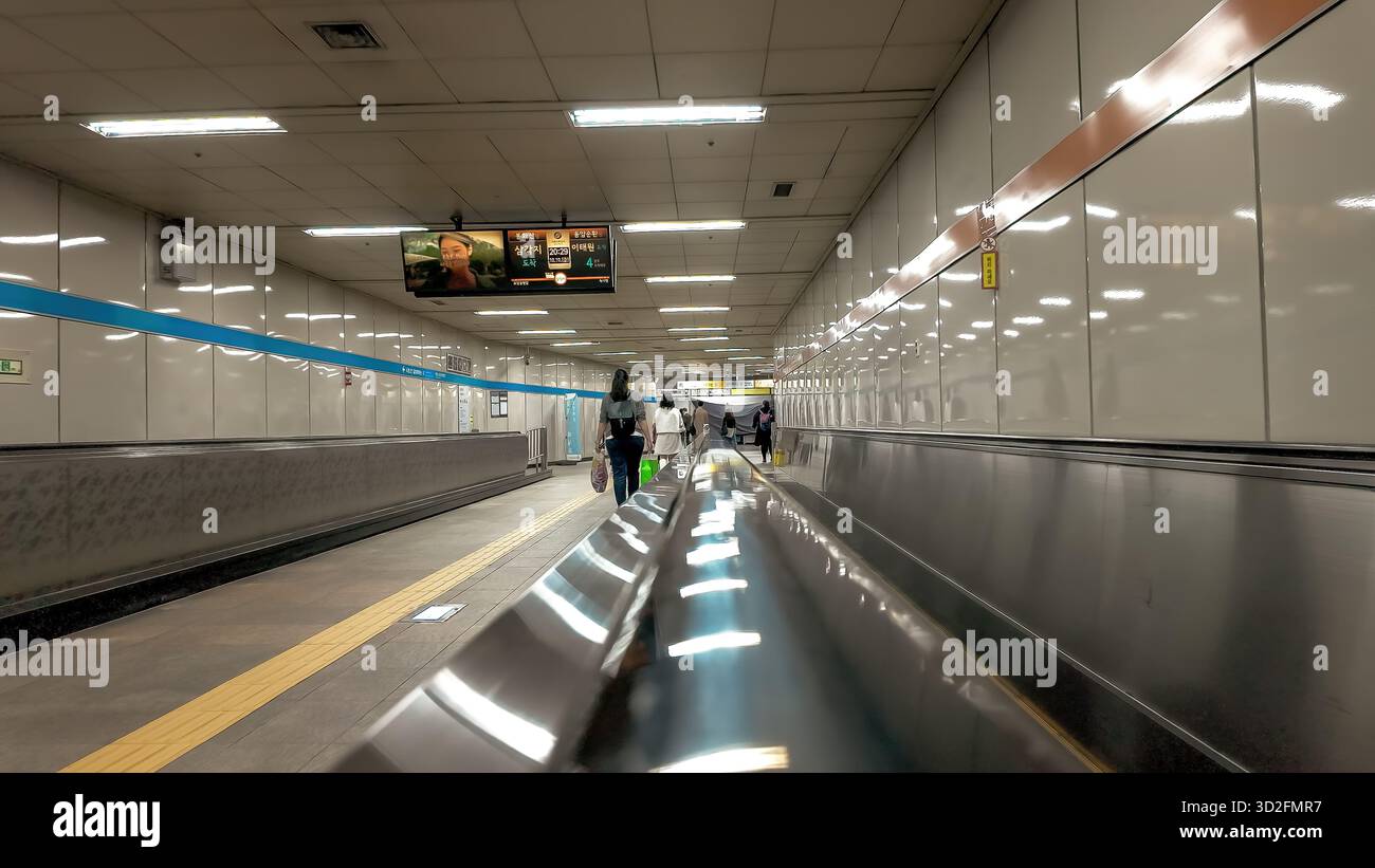 SEOUL, SOUTH KOREA - OCTOBER 11, 2025 - Passengers using the moving ...