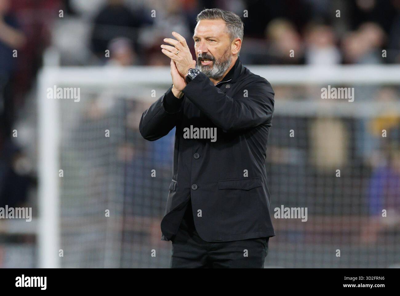 Heart of Midlothian manager Derek McInnes applauds the fans after the ...