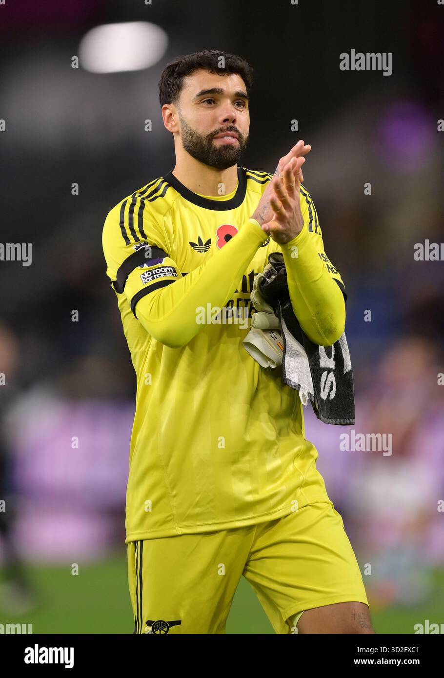 Arsenal goalkeeper David Raya applauds the fans after the final whistle ...