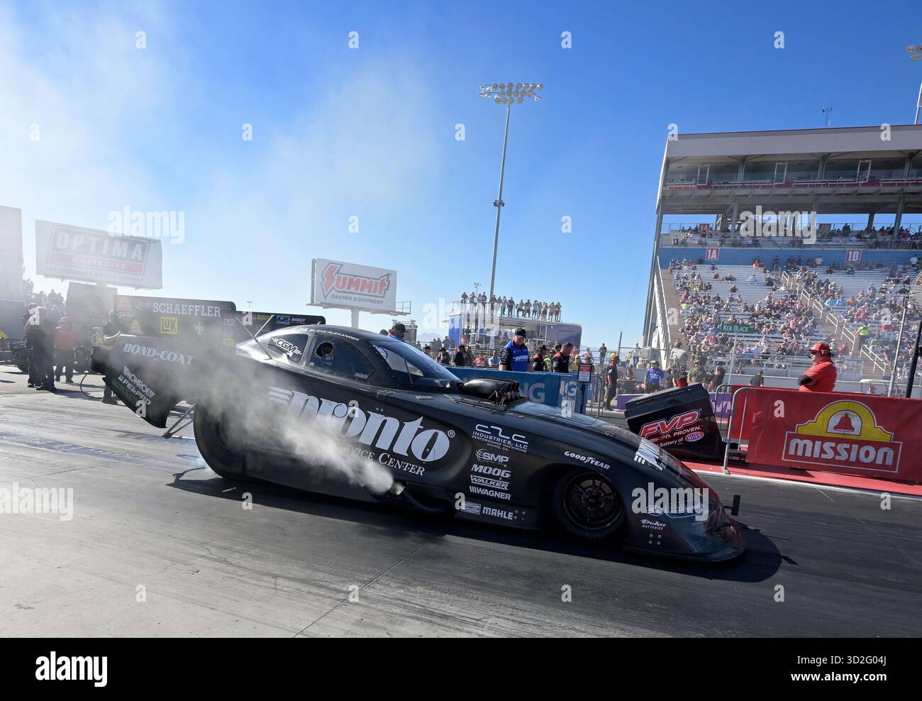 LAS VEGAS, NV - OCTOBER 31: Funny Car driver Blake Alexander does his ...