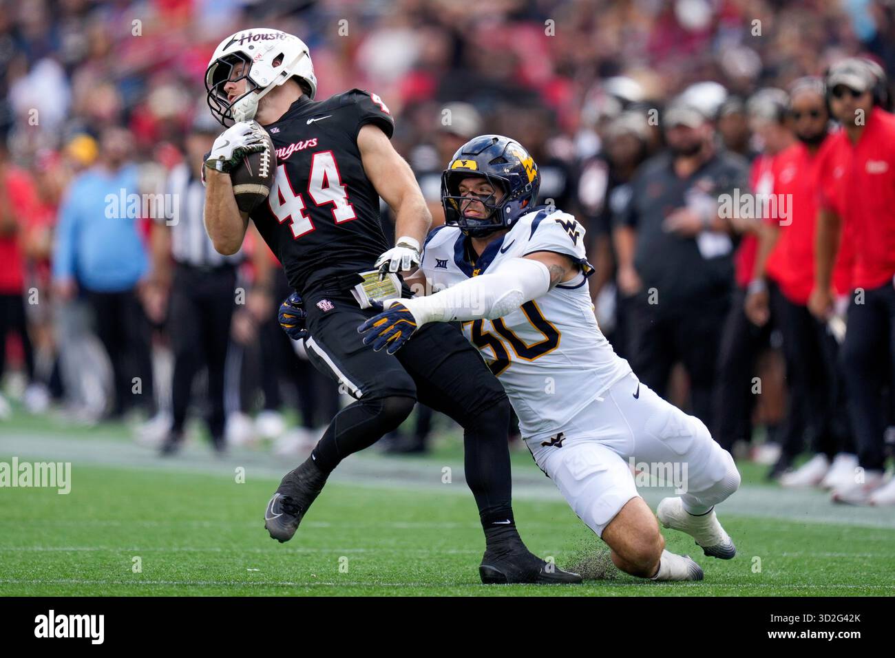 Houston running back Dean Connors (44) avoids the tackle of West ...