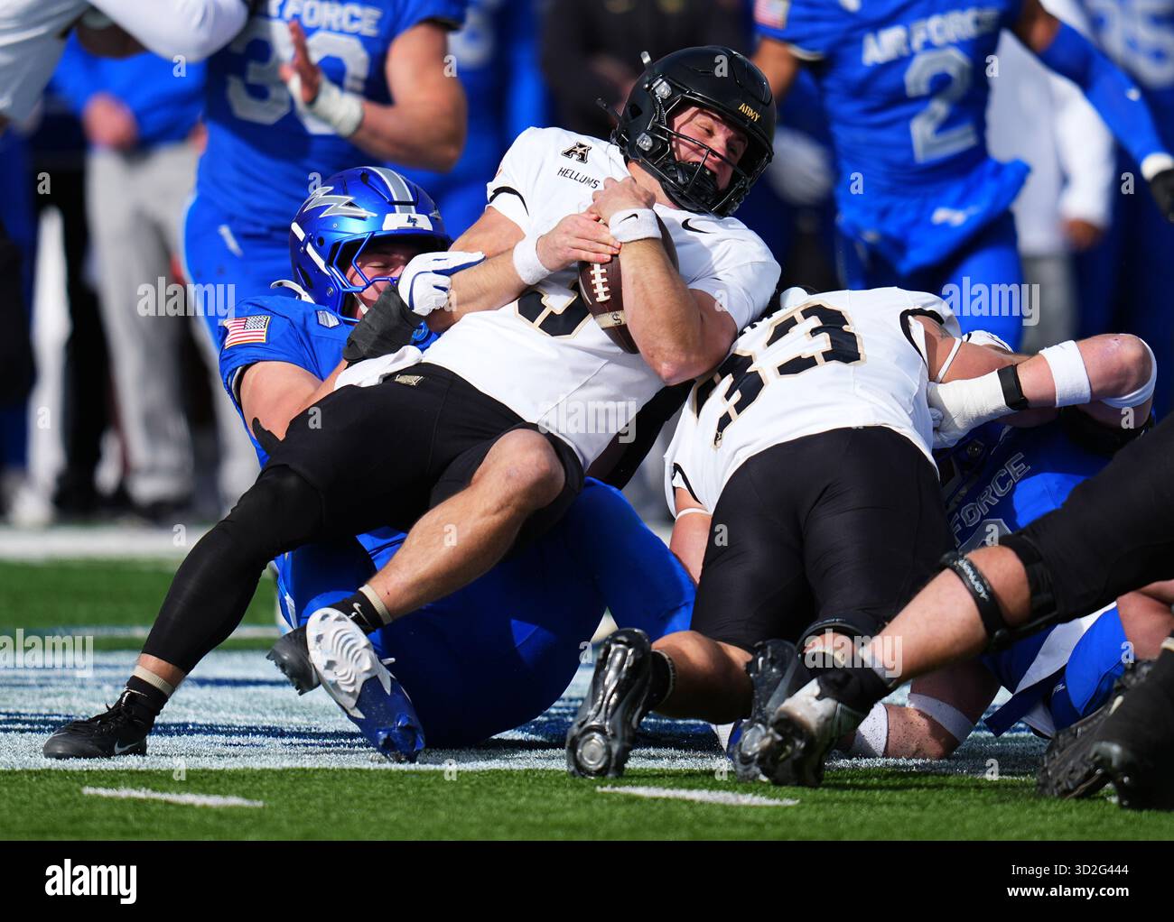 Army quarterback Cale Hellums (3) is tackled by Air Force linebacker ...