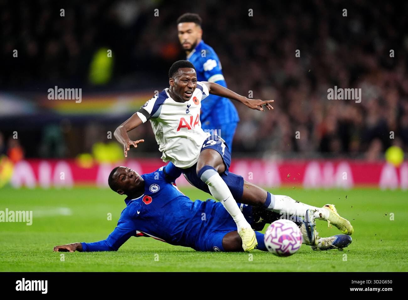 Chelsea's Moises Caicedo (left) and Tottenham Hotspur's Pape Matar Sarr ...