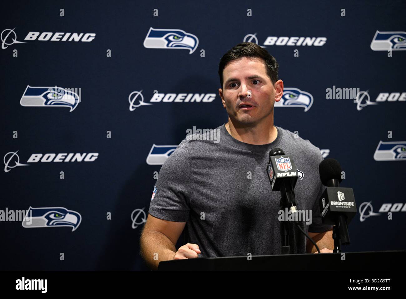 Seattle Seahawks head coach Mike MacDonald talks with reporters after ...