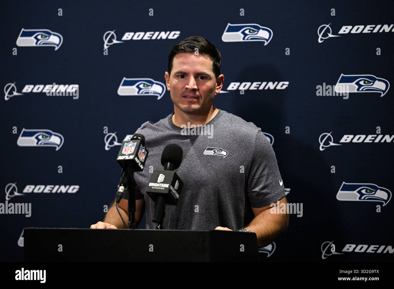 Seattle Seahawks head coach Mike MacDonald talks with reporters after ...