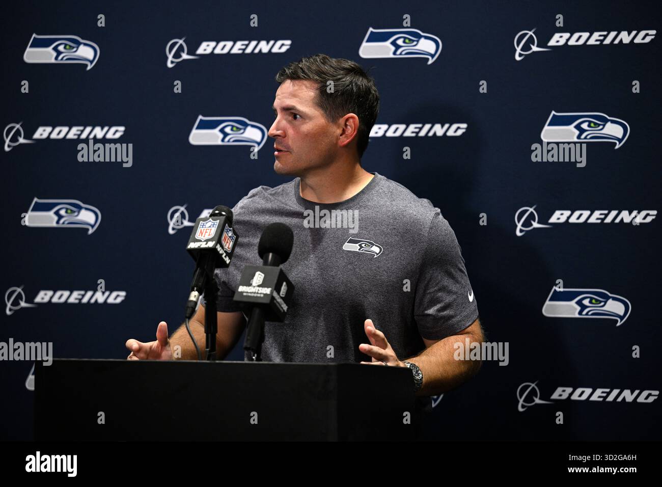 Seattle Seahawks head coach Mike MacDonald talks with reporters after ...