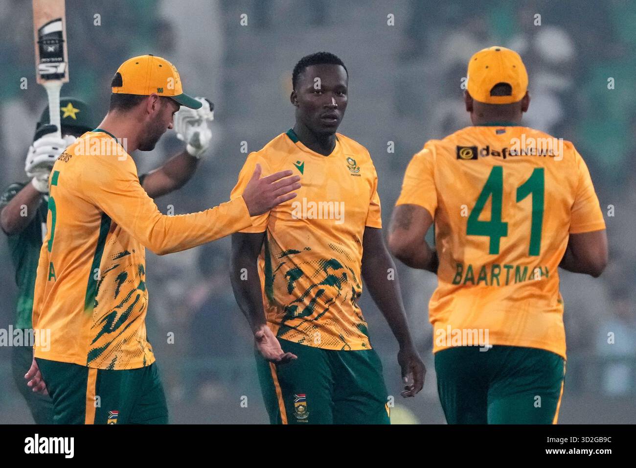 South Africa's Andile Simelane, center, celebrates with teammates after ...