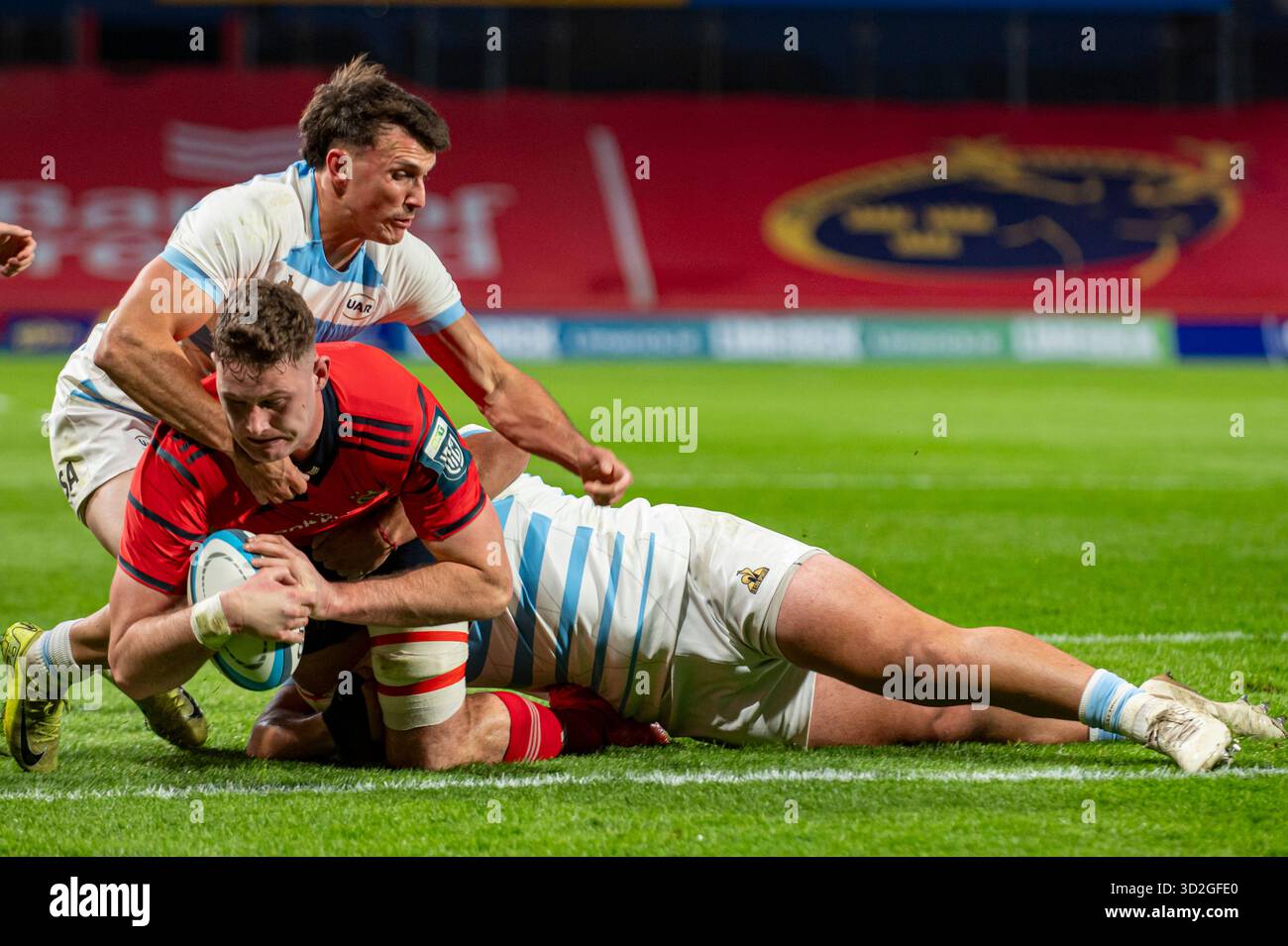 Evan O'Connell of Munster scores a try during the international ...