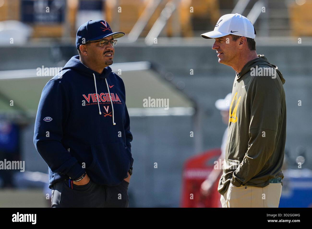 Virginia head coach Tony Elliott, left, and California head coach ...