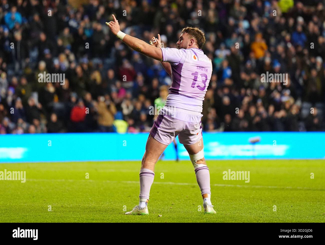 Scotland's Ollie Smith celebrates scoring the last try of the game ...