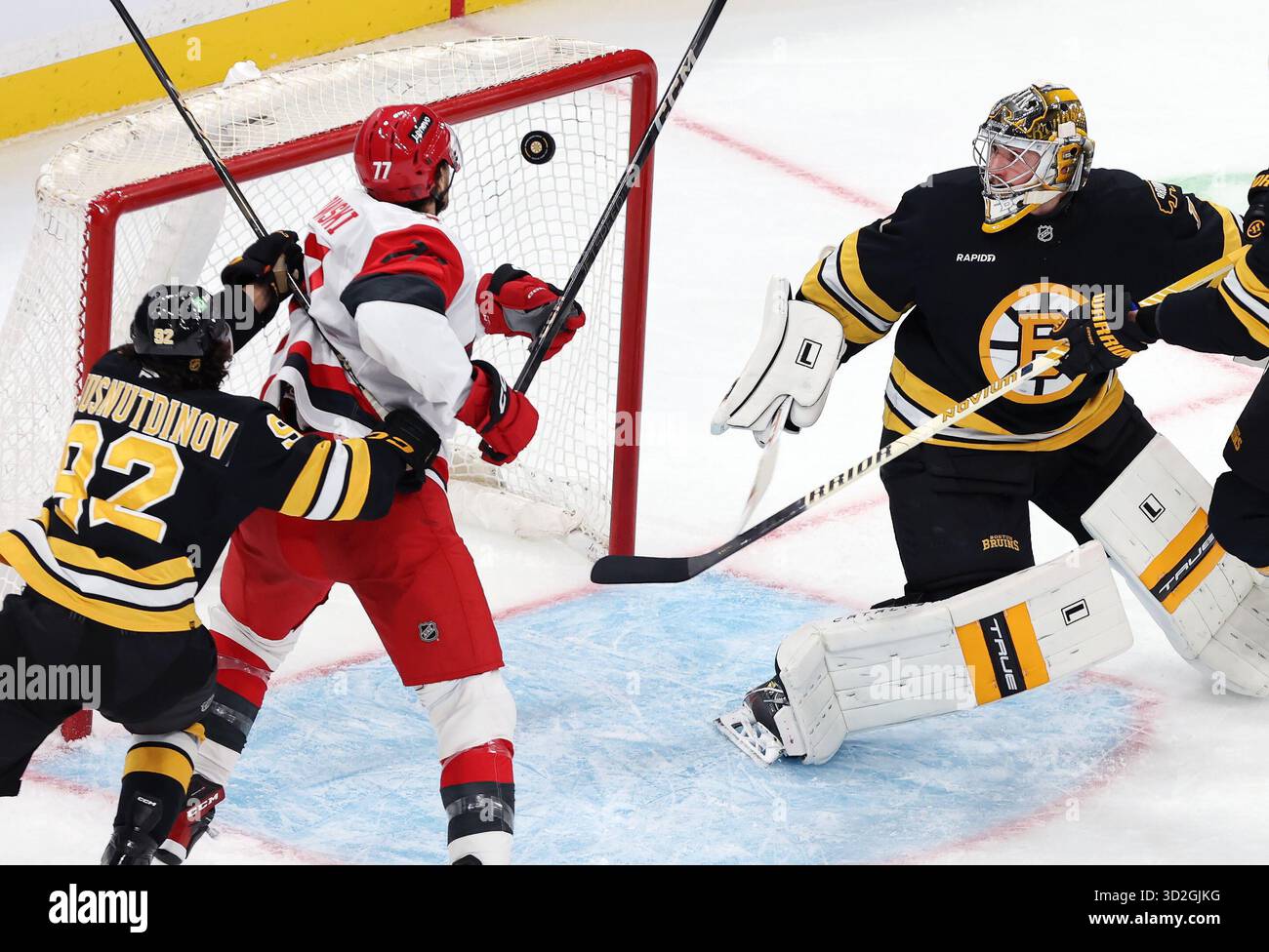 Boston Bruins goalie Jeremy Swayman eyes the puck that Carolina ...