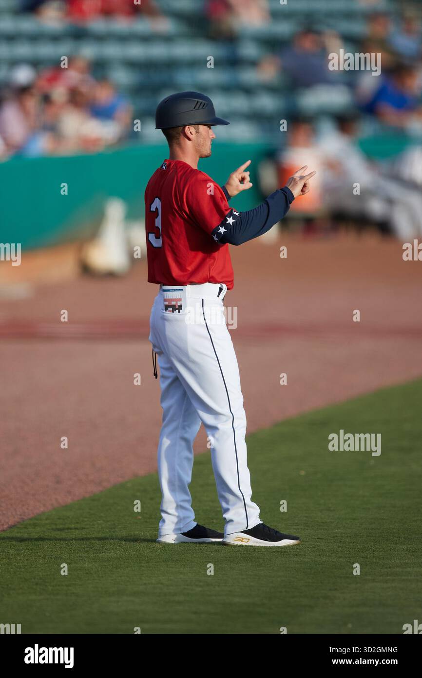 Charleston RiverDogs manager Blake Butera (3) coaches third base during ...