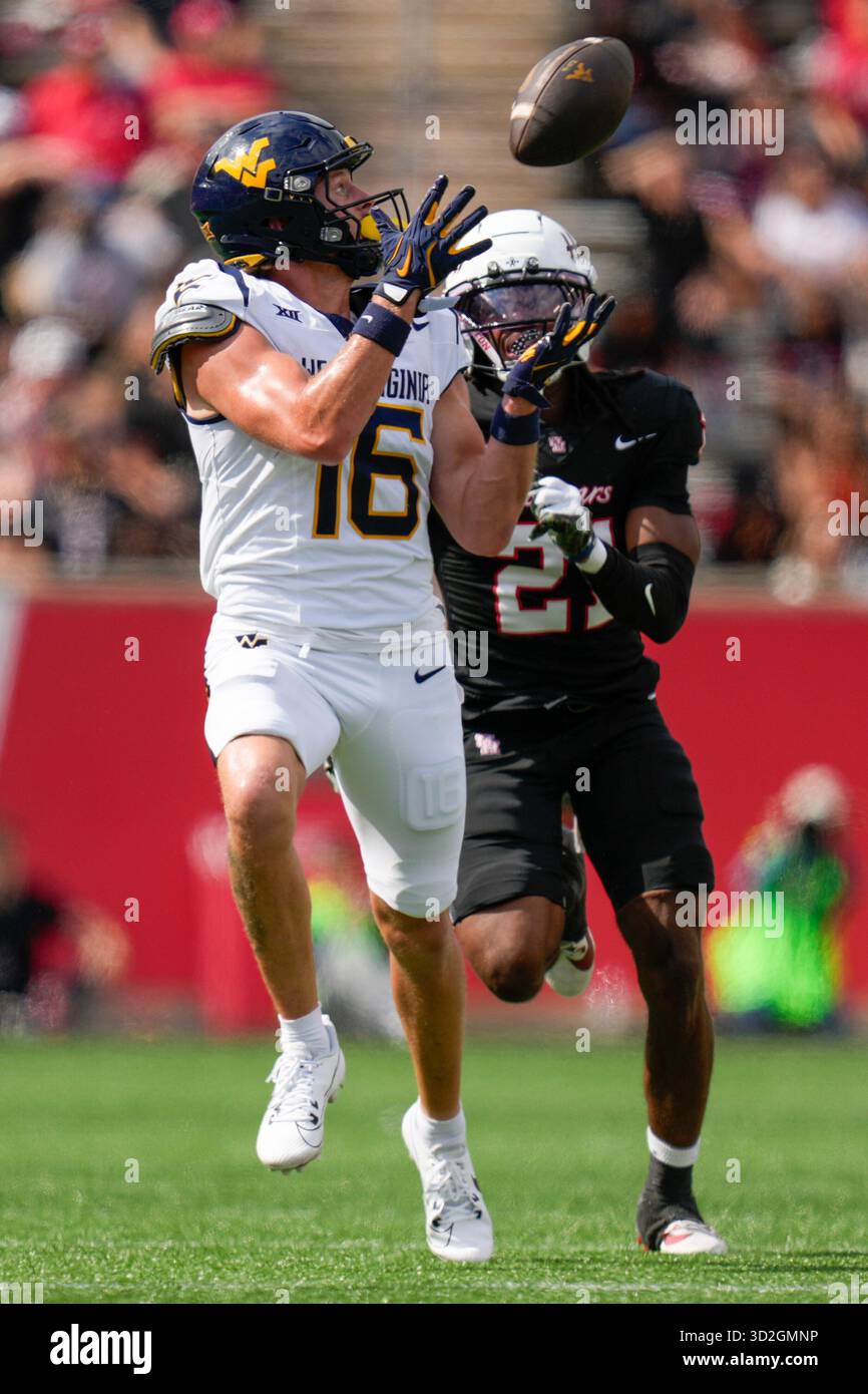 West Virginia wide receiver Jeff Weimer, left, catches a pass ahead of ...